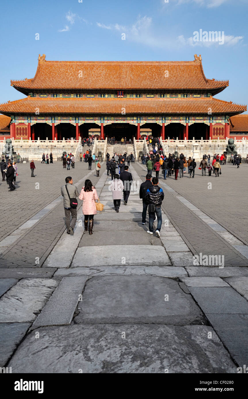 tourists inside in the first courtyard outside leading to gate of ...