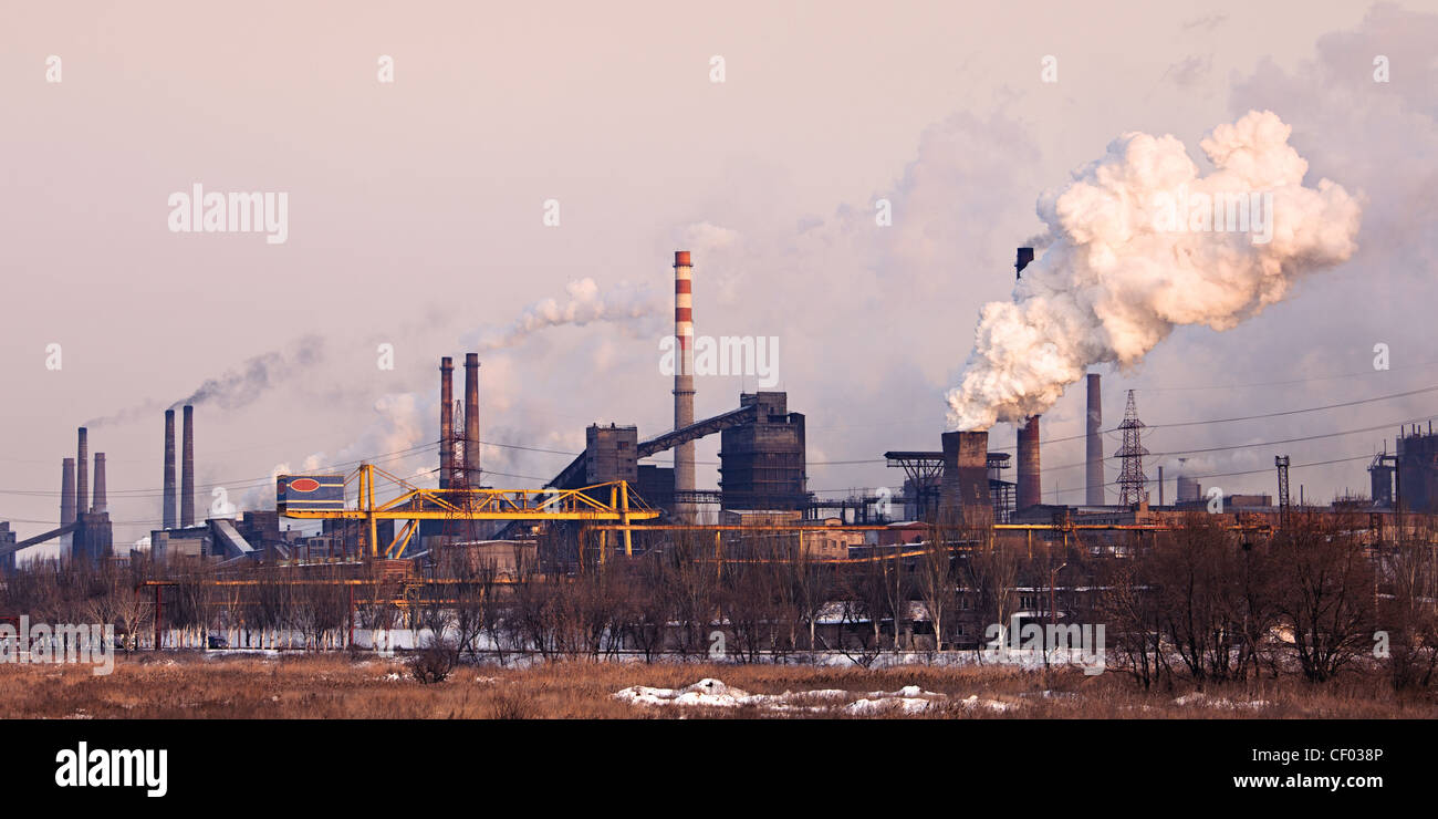 Industrial landscape with factory chimney Stock Photo - Alamy