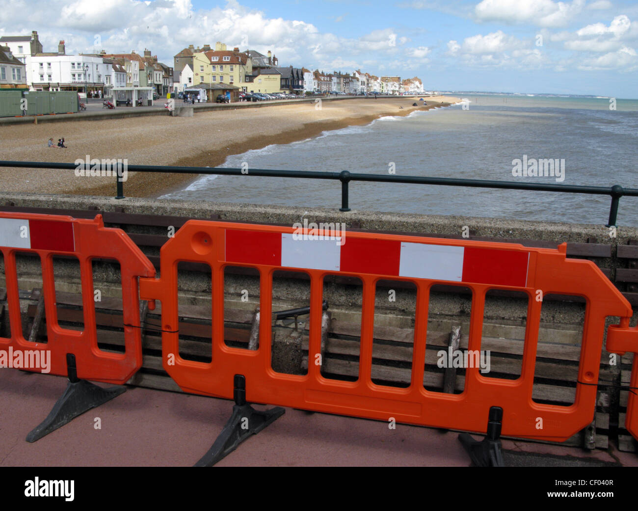 Plastic orange red guard rails on the pier at Deal in Kent, looking out ...