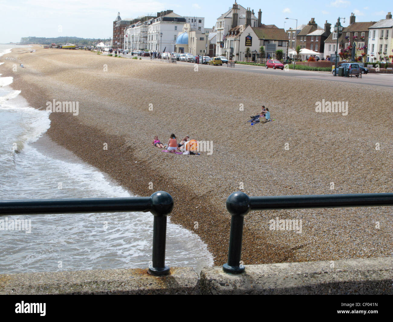 People on the pebble beach at Deal, in Kent, viewed from the Pier Stock ...