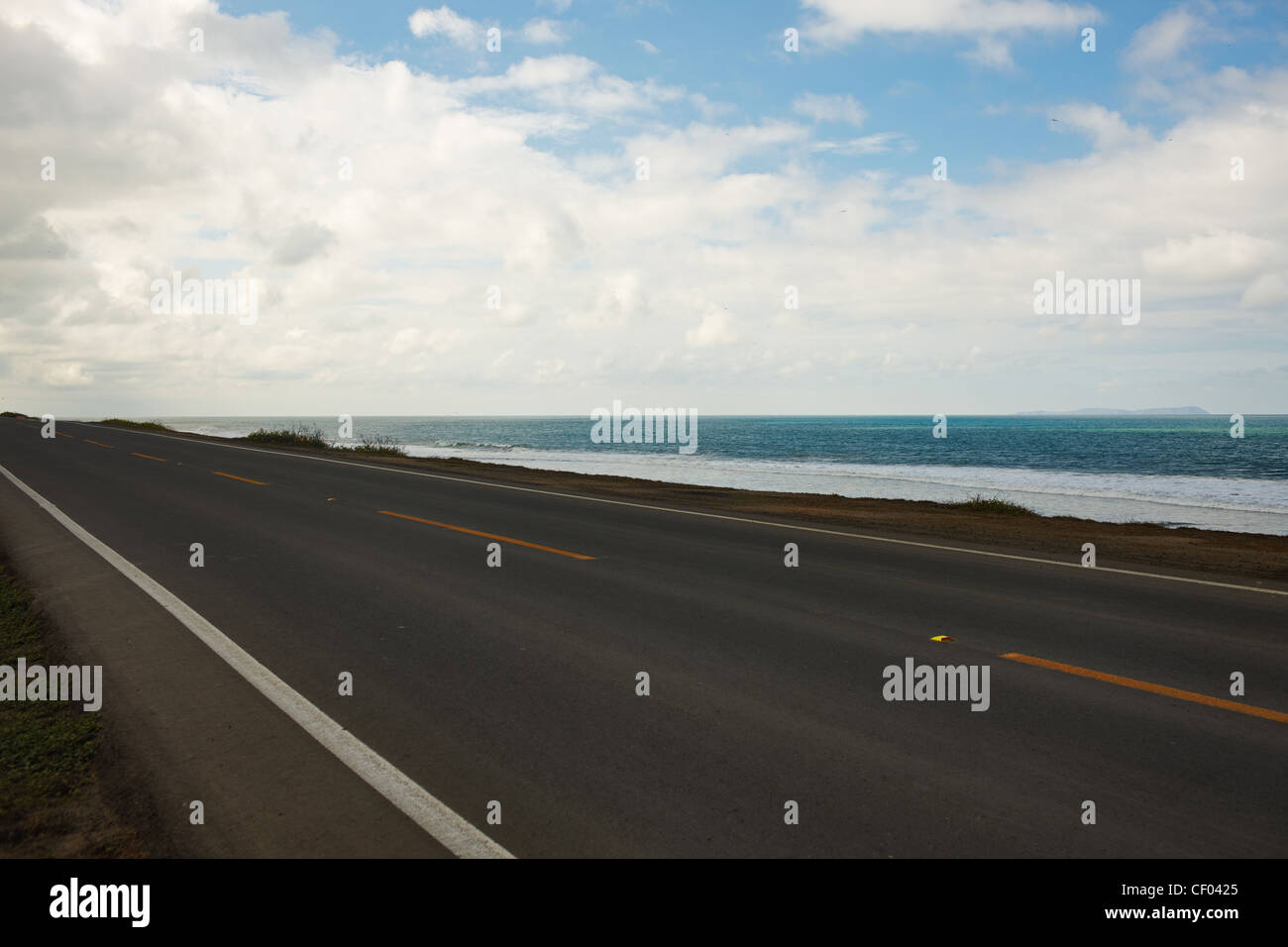 Straight road along the Pacific Ocean Stock Photo - Alamy