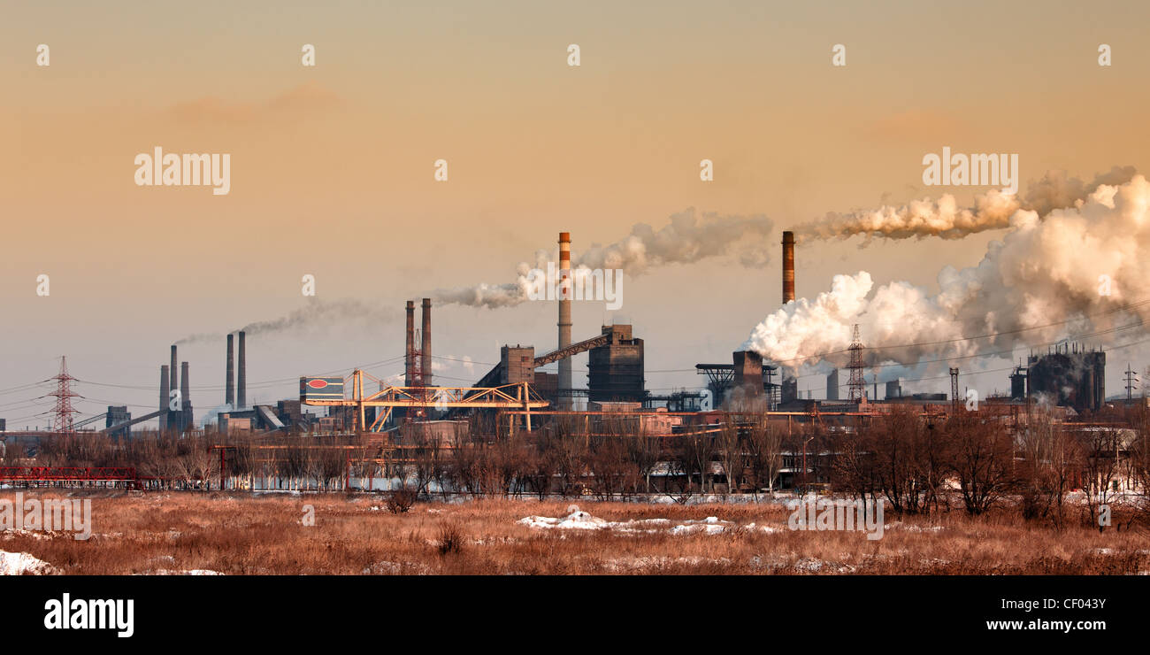Industrial landscape with factory chimney Stock Photo - Alamy