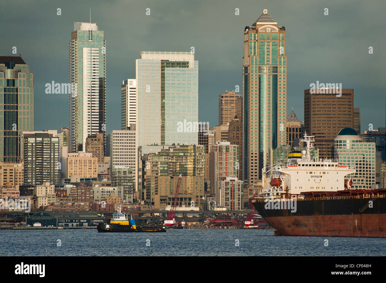 A dramatic sunset highlights the beautiful Seattle waterfront across ...