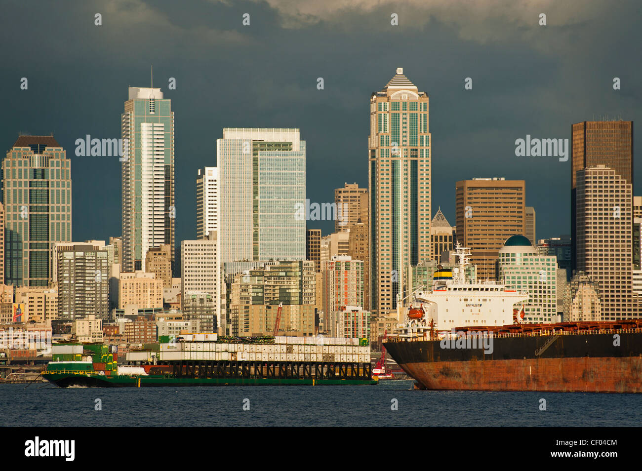 A dramatic sunset highlights the beautiful Seattle waterfront across ...