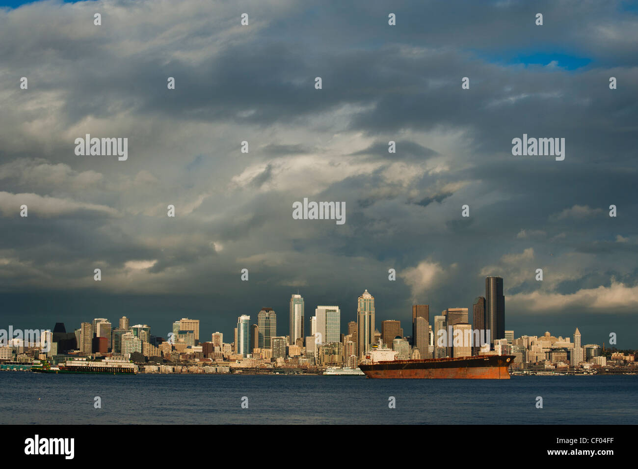 A dramatic sunset highlights the beautiful Seattle waterfront across ...