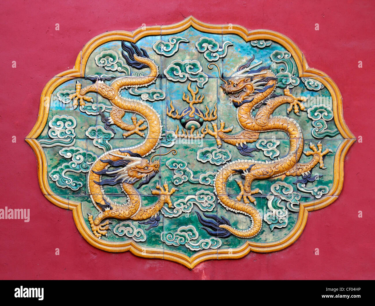 green decorative terracotta tiles with yellow dragon motif emblem bas ...