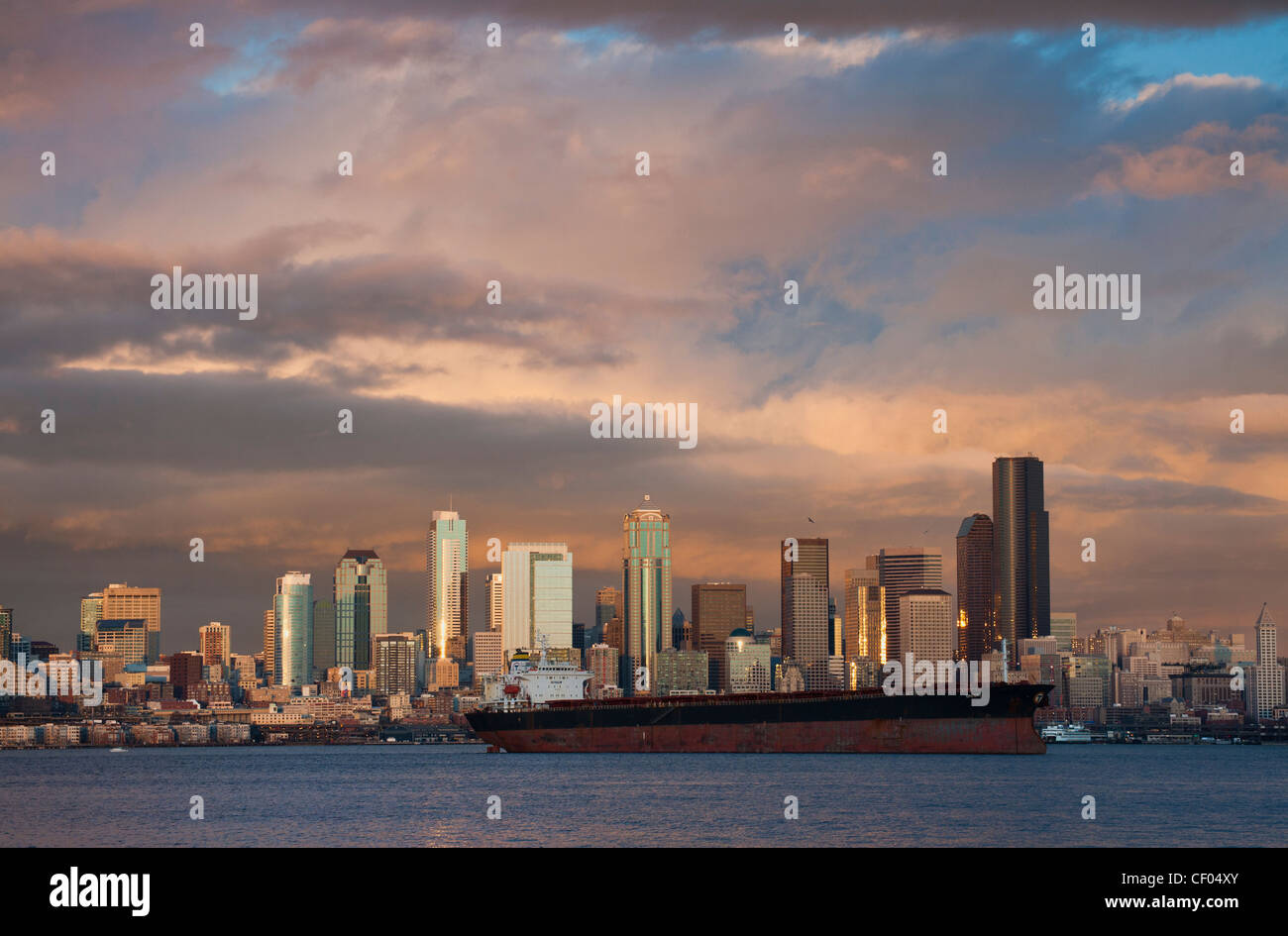 A dramatic sunset highlights the beautiful Seattle waterfront across ...