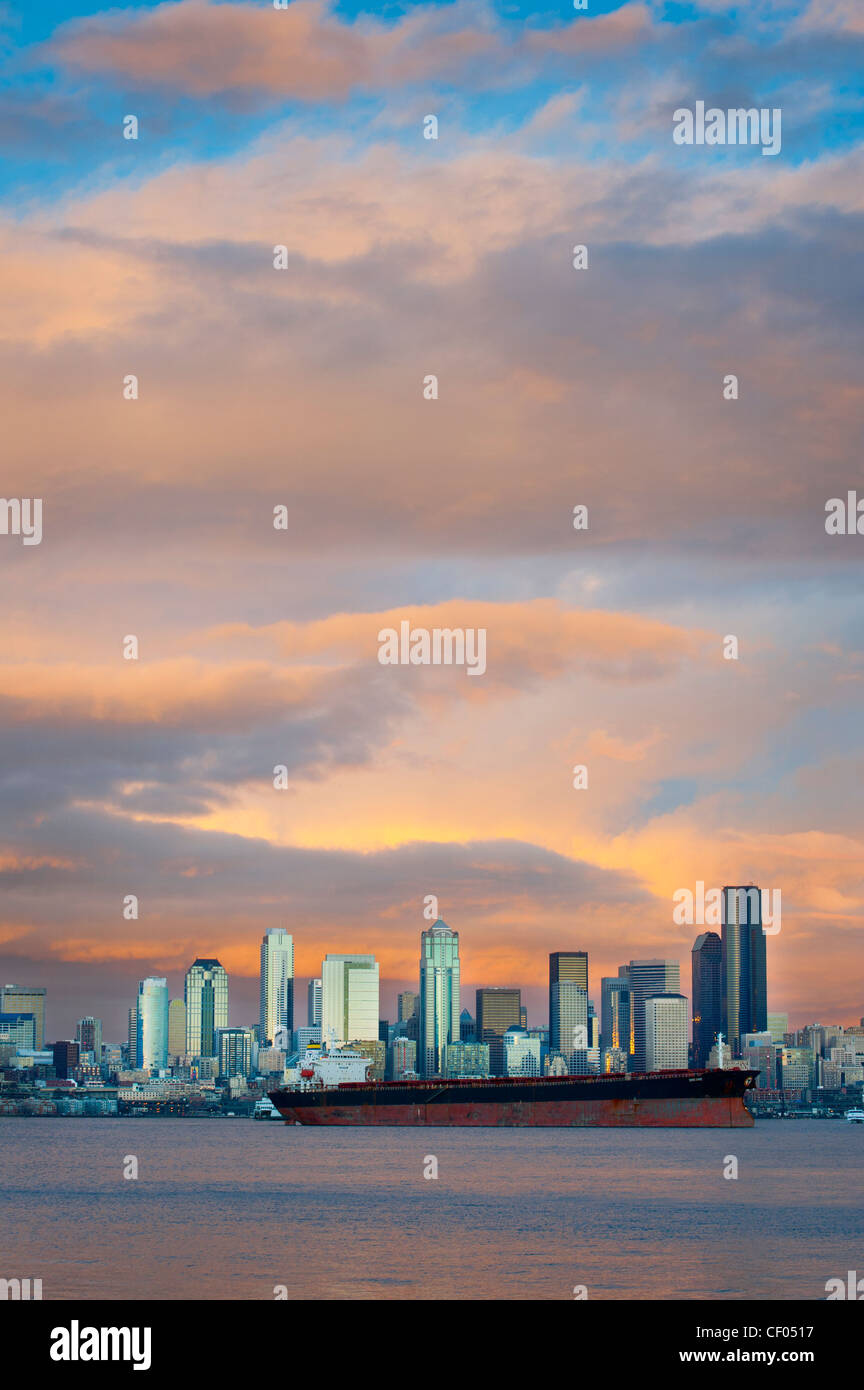 A dramatic sunset highlights the beautiful Seattle waterfront across ...