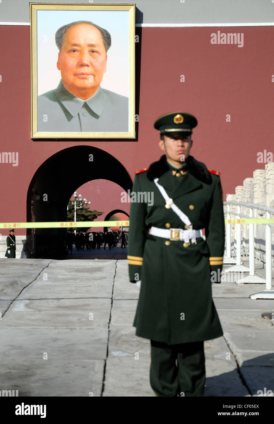 Soldier standing guard under photograph image of Mao Tiananmen Tian ...
