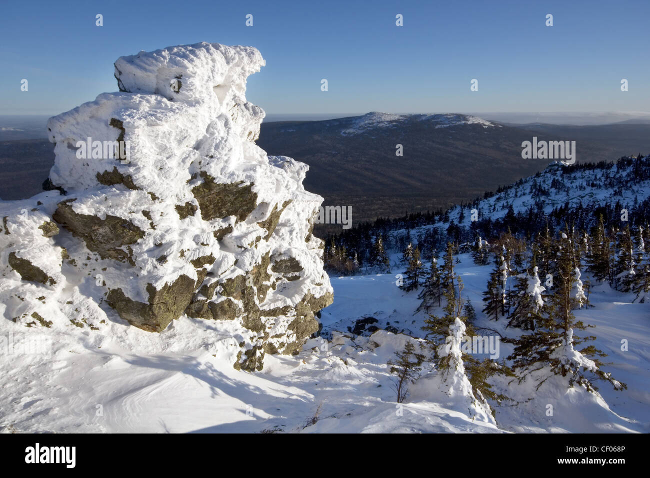 Winter in taiga. Rocks in snow. South Ural mountains. National park ...