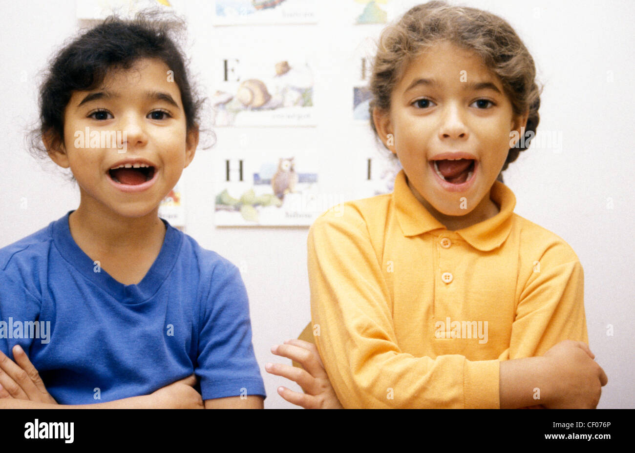 two young girls singing Stock Photo - Alamy