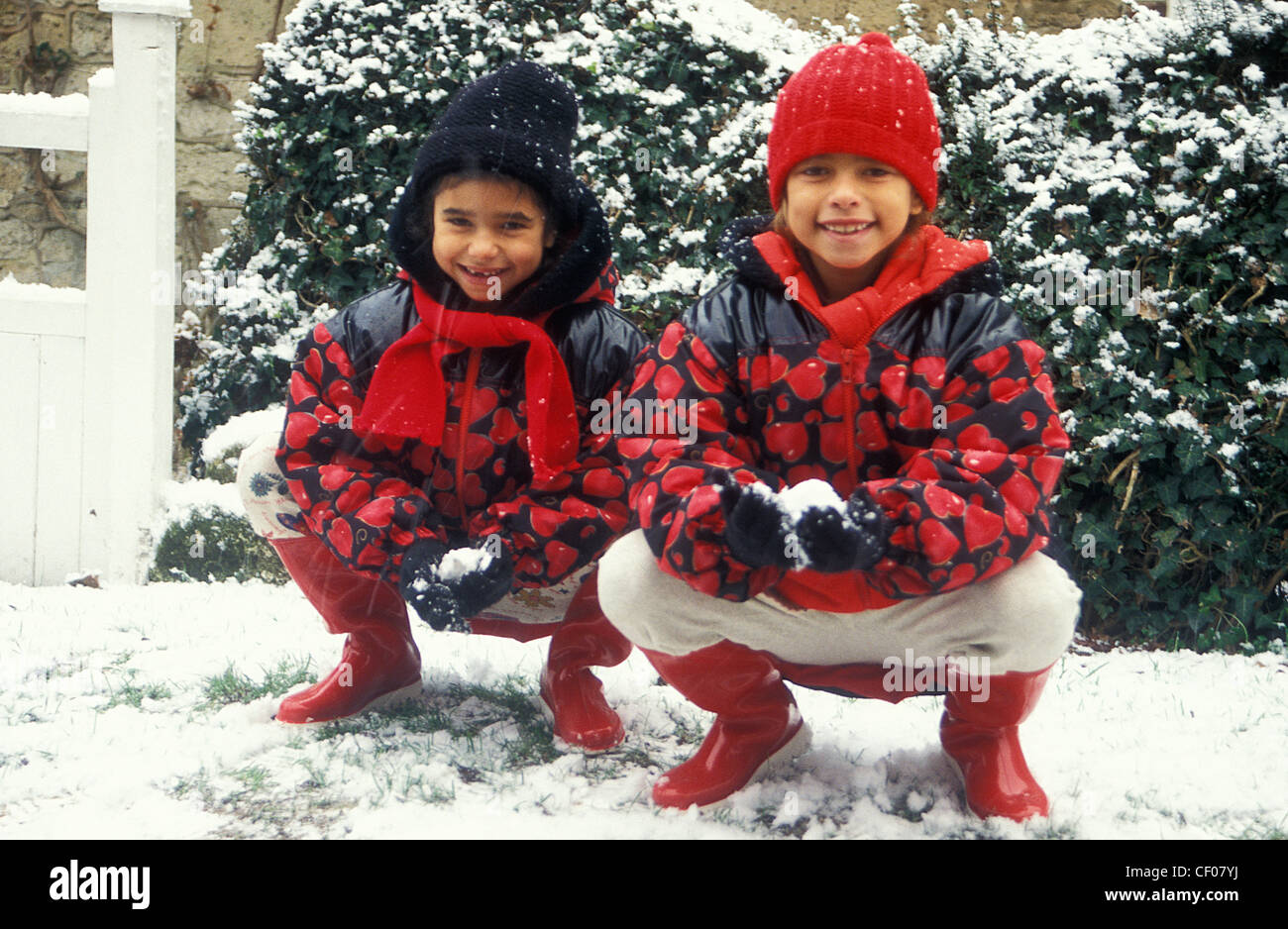 two girls in snow Stock Photo - Alamy
