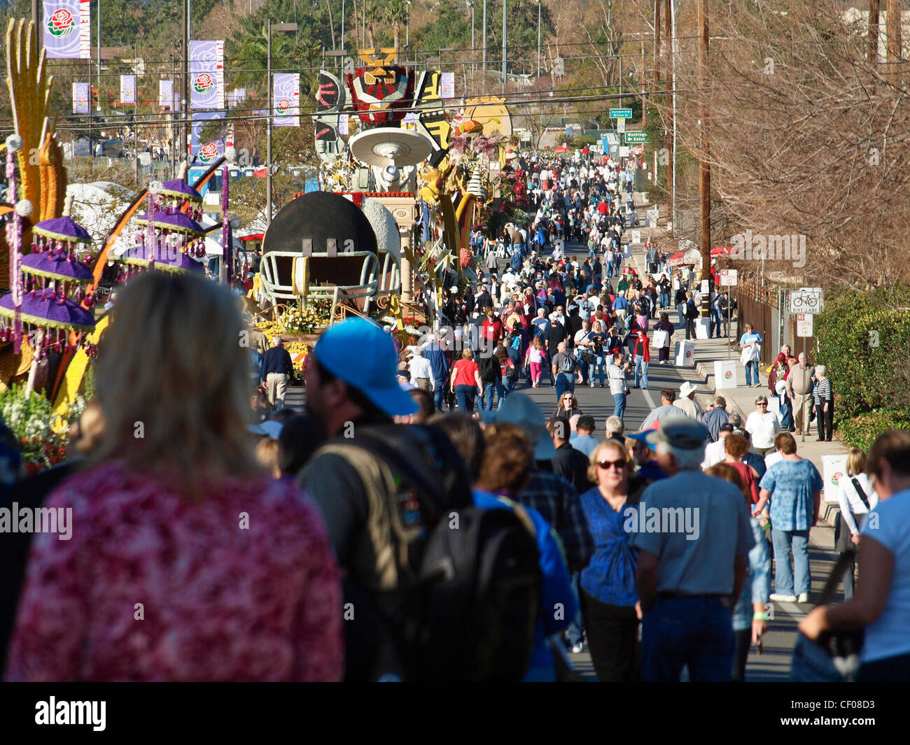 Crowds of people view floats from the 2012 Rose Parade on display one ...