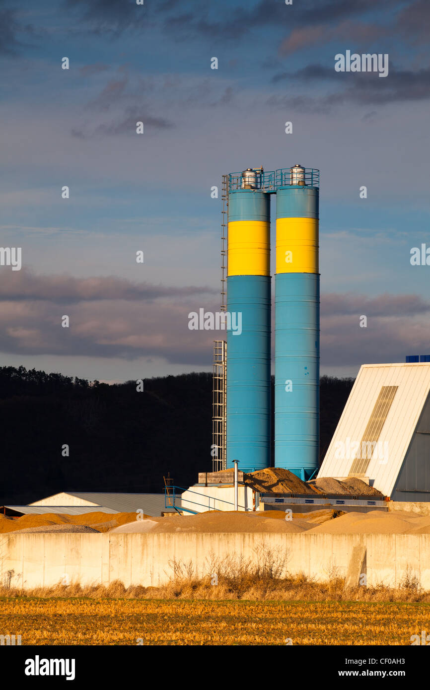 Blue concrete silos at sunset Stock Photo - Alamy
