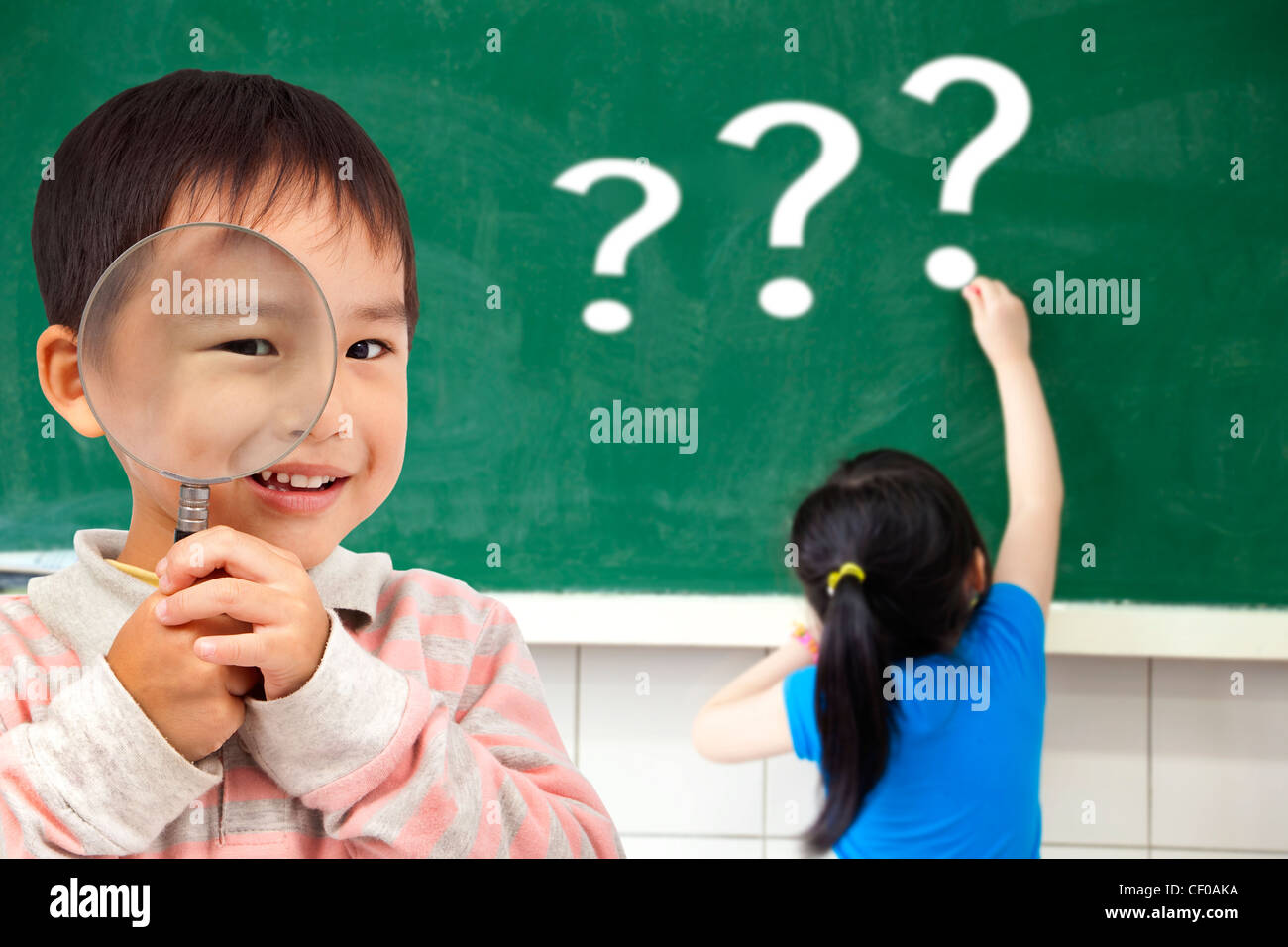 happy kids with drawing question mark in the classroom Stock Photo - Alamy
