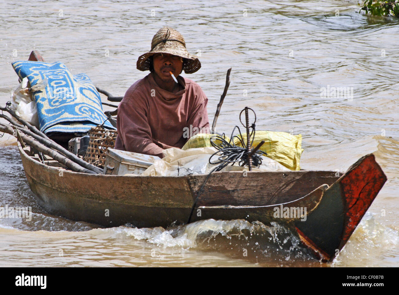 Cambodian man smoking cigarette hi-res stock photography and images - Alamy
