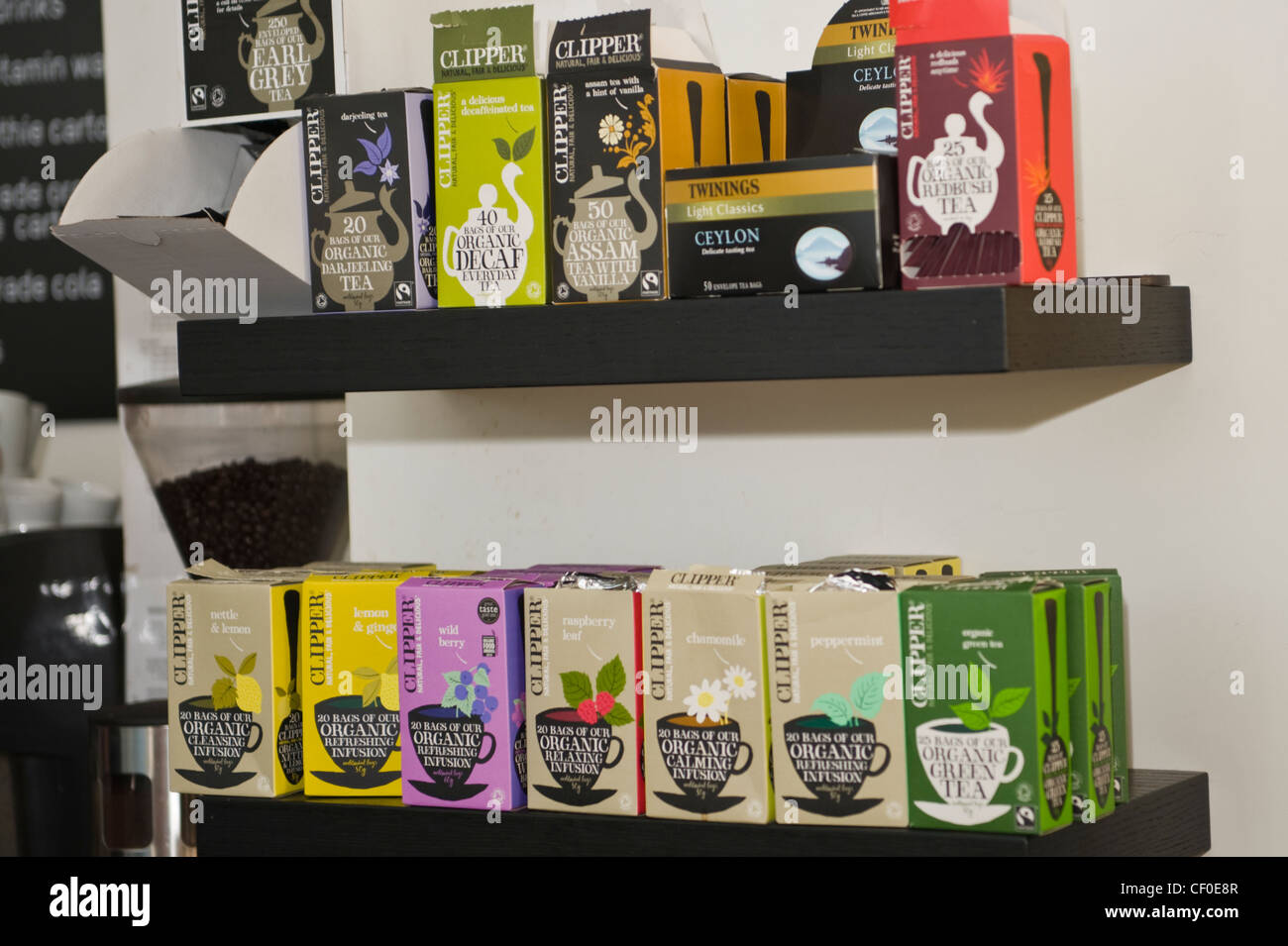 Selection of various boxes of fairtrade tea on shelf in café Stock ...
