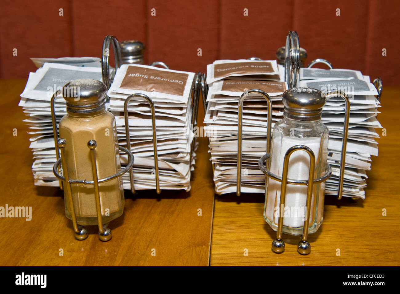 Condiment set salt and pepper pots on table in café Stock Photo - Alamy