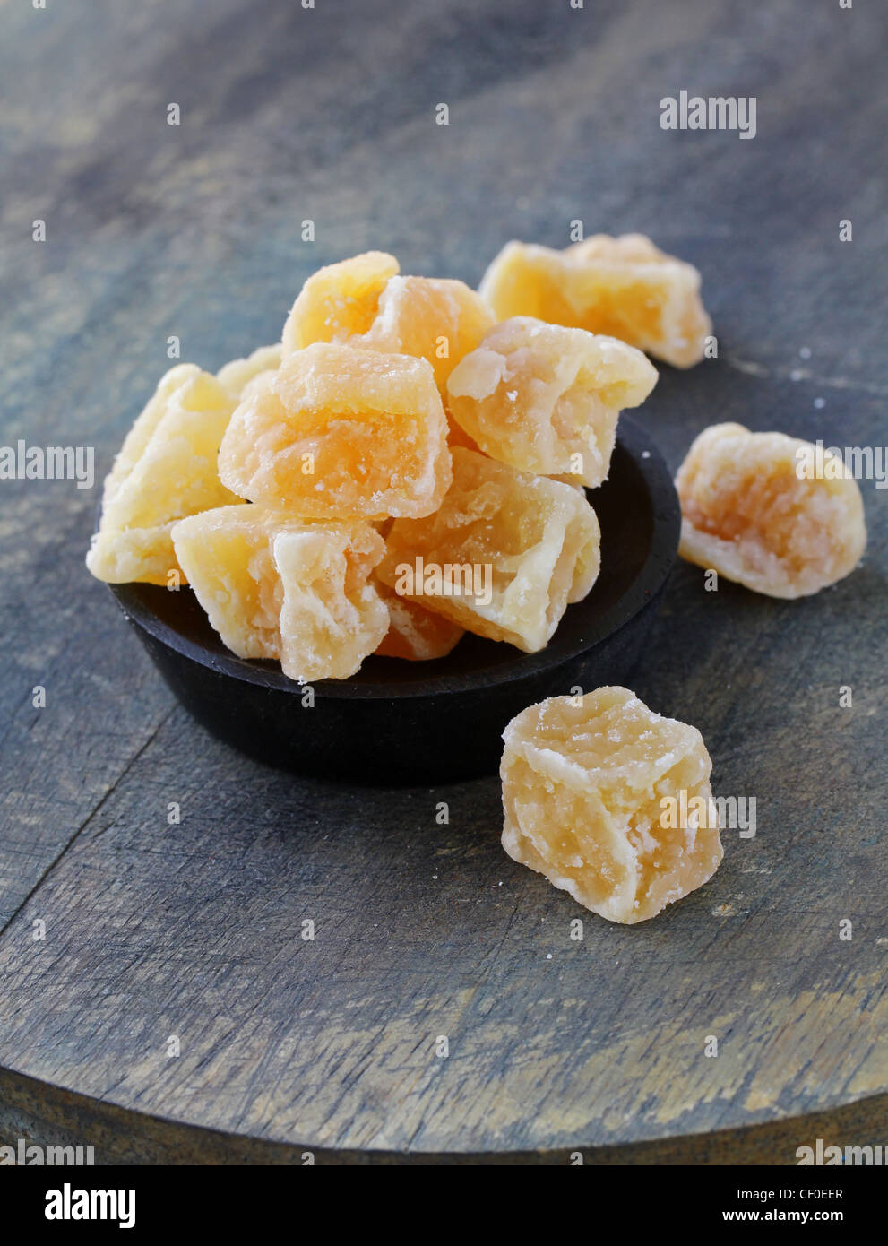candied ginger on a dark background Stock Photo - Alamy