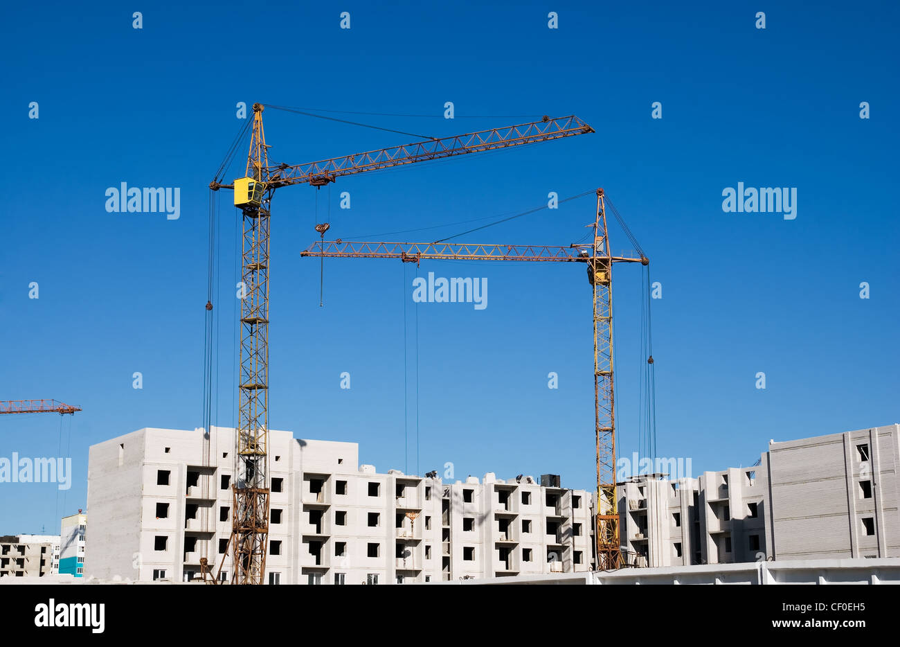 crane and building under construction on the skyline Stock Photo - Alamy