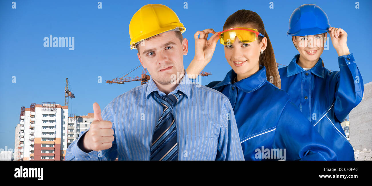 Portrait of architects at in front of construction site, building and ...