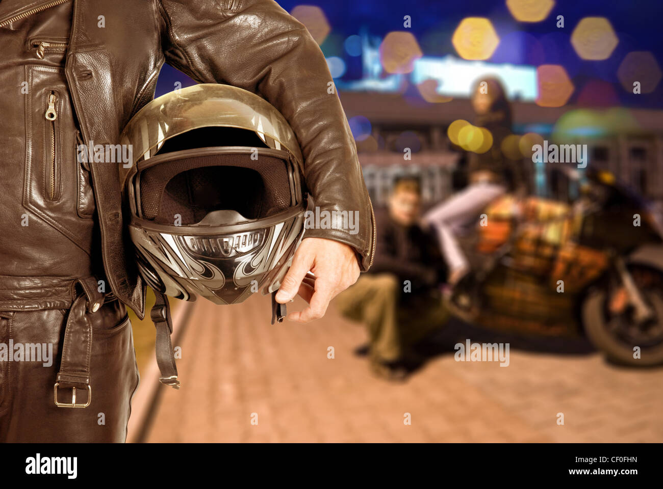 Biker closeup at night city background Stock Photo - Alamy