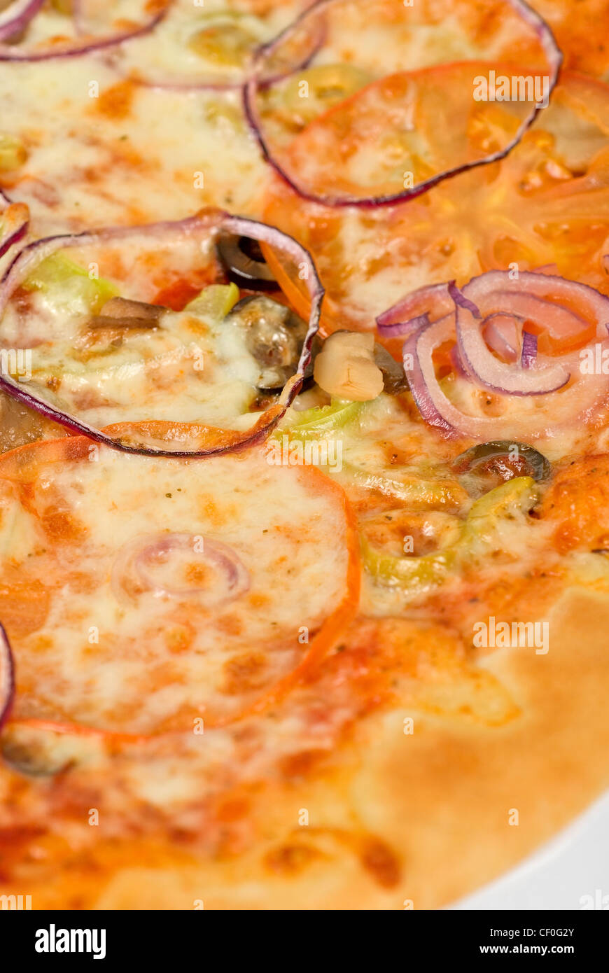 vegetable pizza closeup with tomato, Bulgarian pepper, onion, olive ...