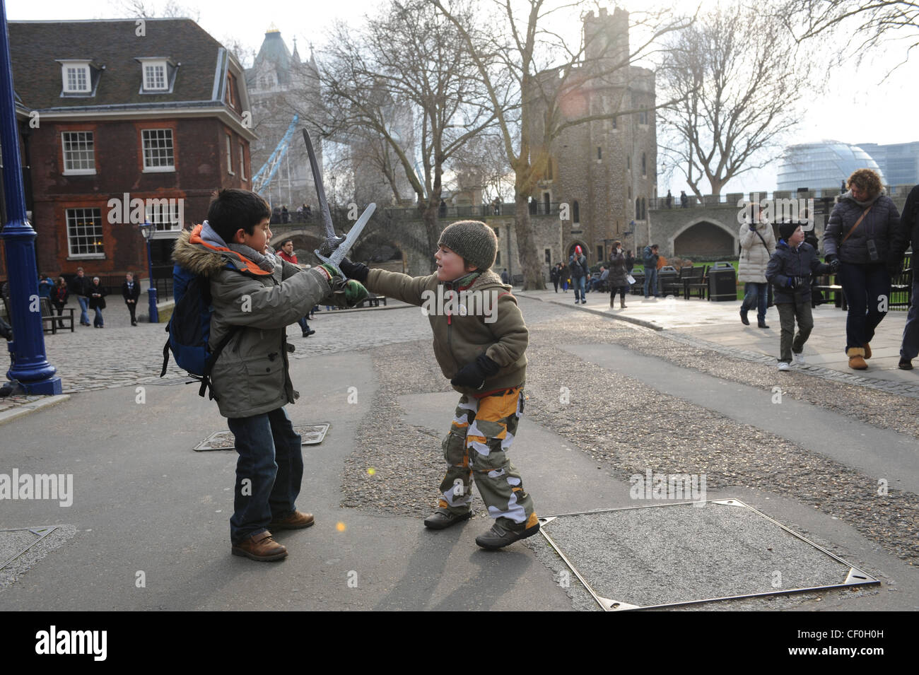 Two boys play fighting in The Tower of london, uk Stock Photo - Alamy