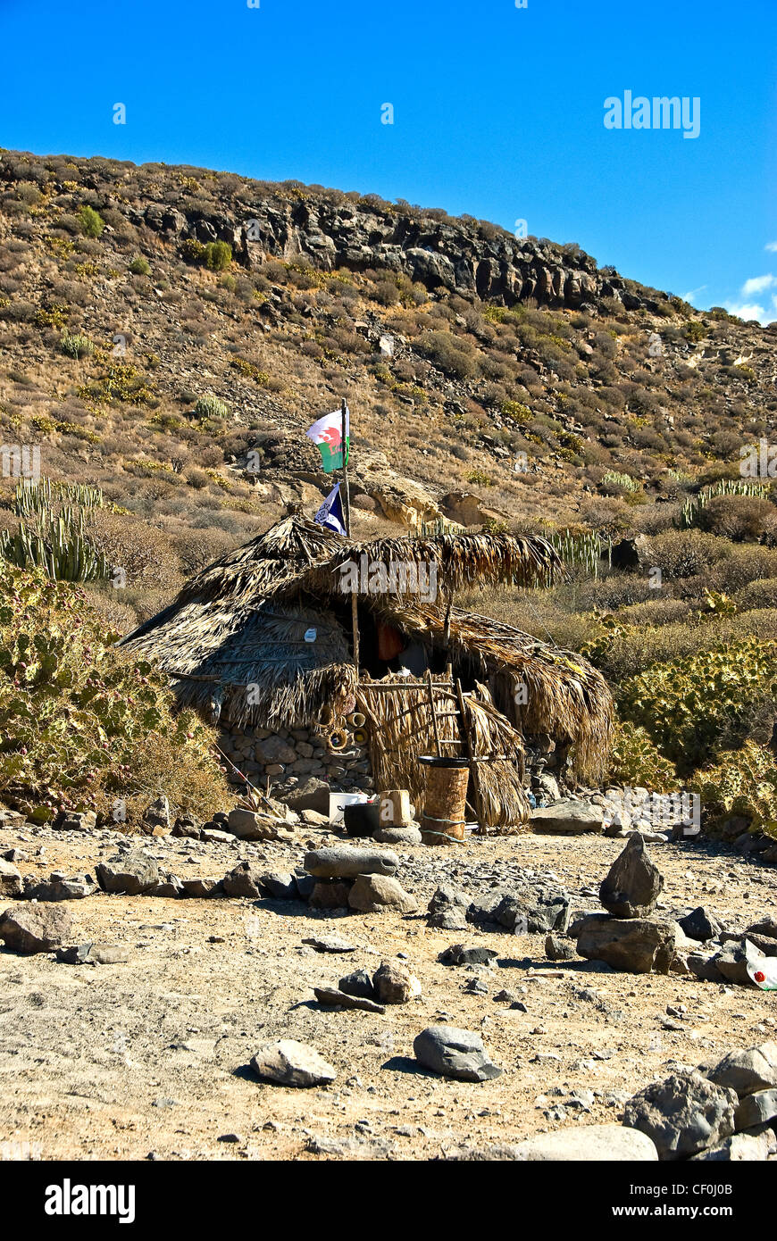 Ramshackle shack built in a quiet cove, close to the beach. camp cave ...