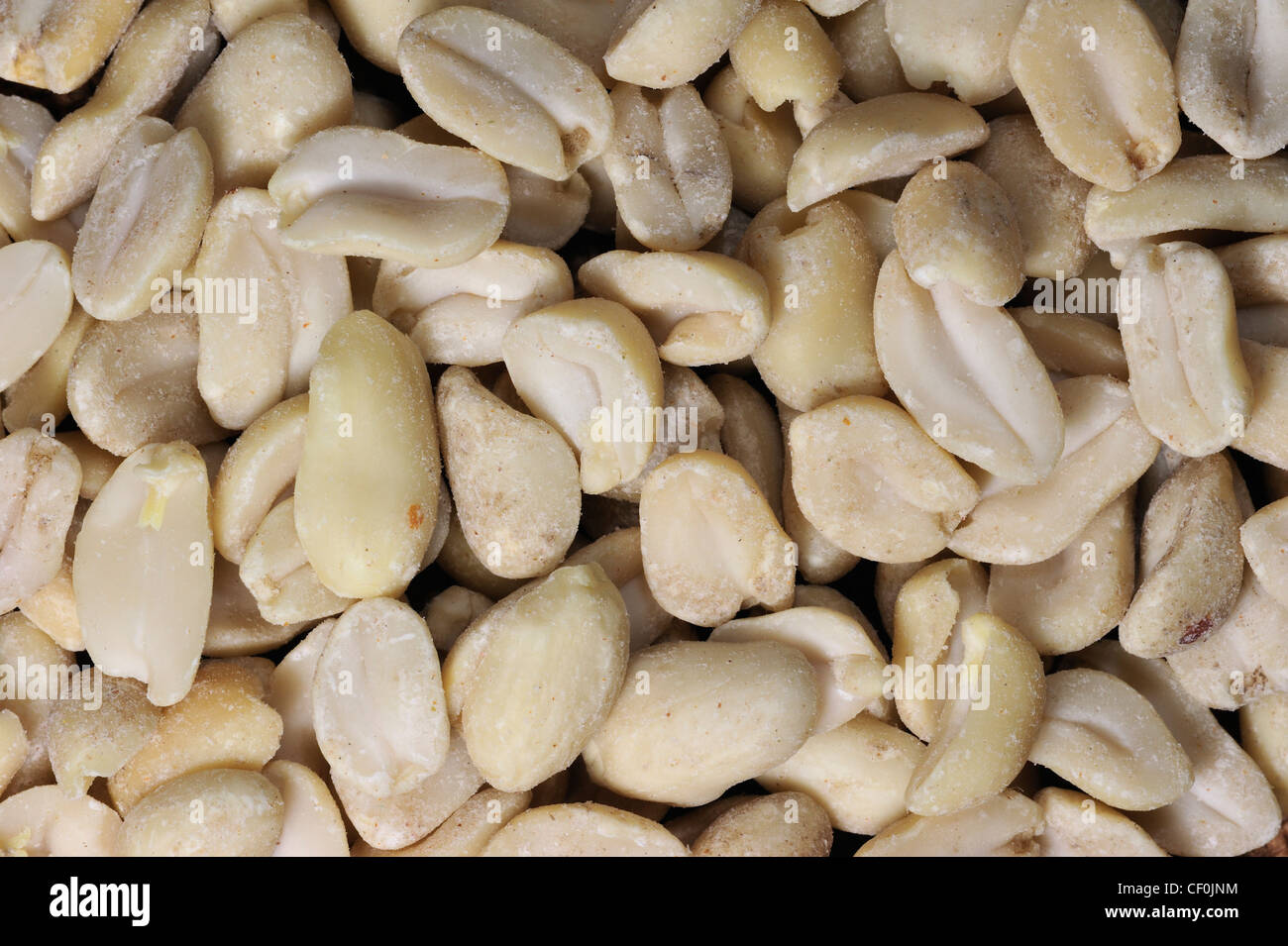 Pealed peanuts as bird feed for birds at birdfeeder in winter Stock ...
