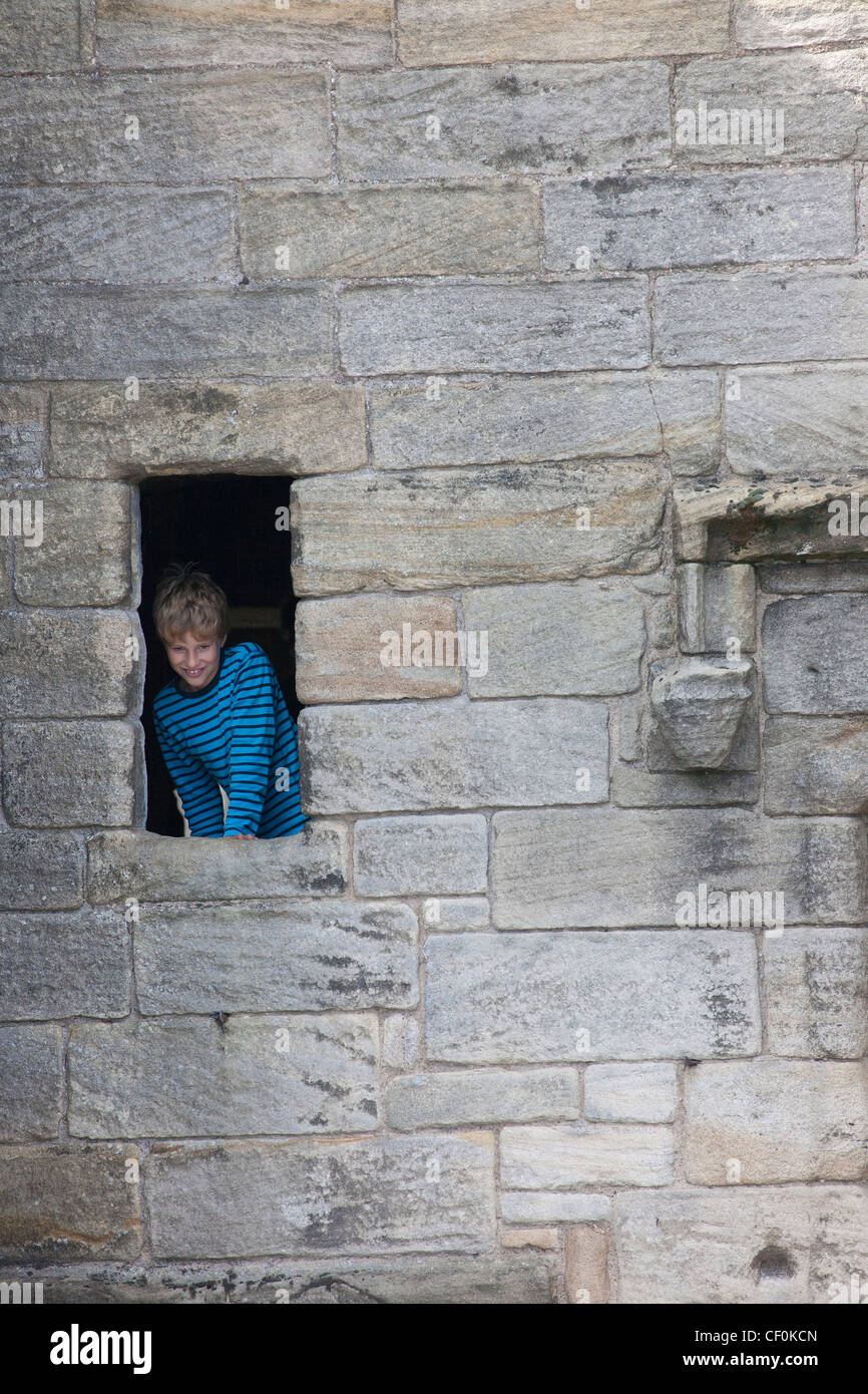 Young visitor looks from window hi-res stock photography and images - Alamy