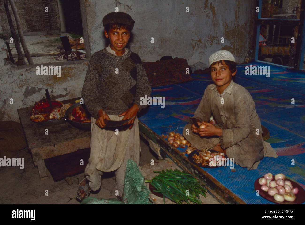 Boys preparing food for dinner Stock Photo - Alamy