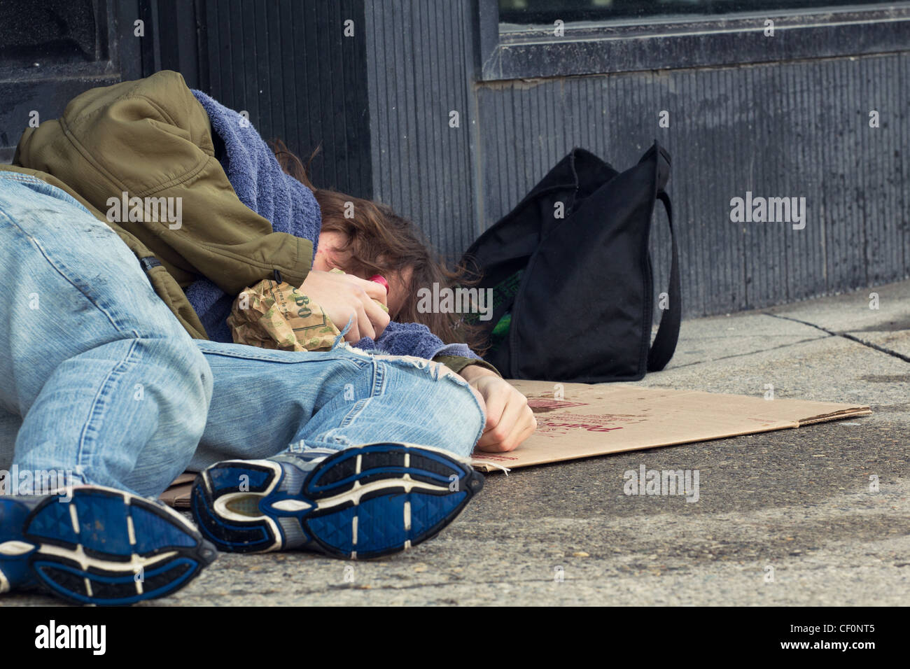 Alcoholic homeless man sleeping on street Stock Photo - Alamy