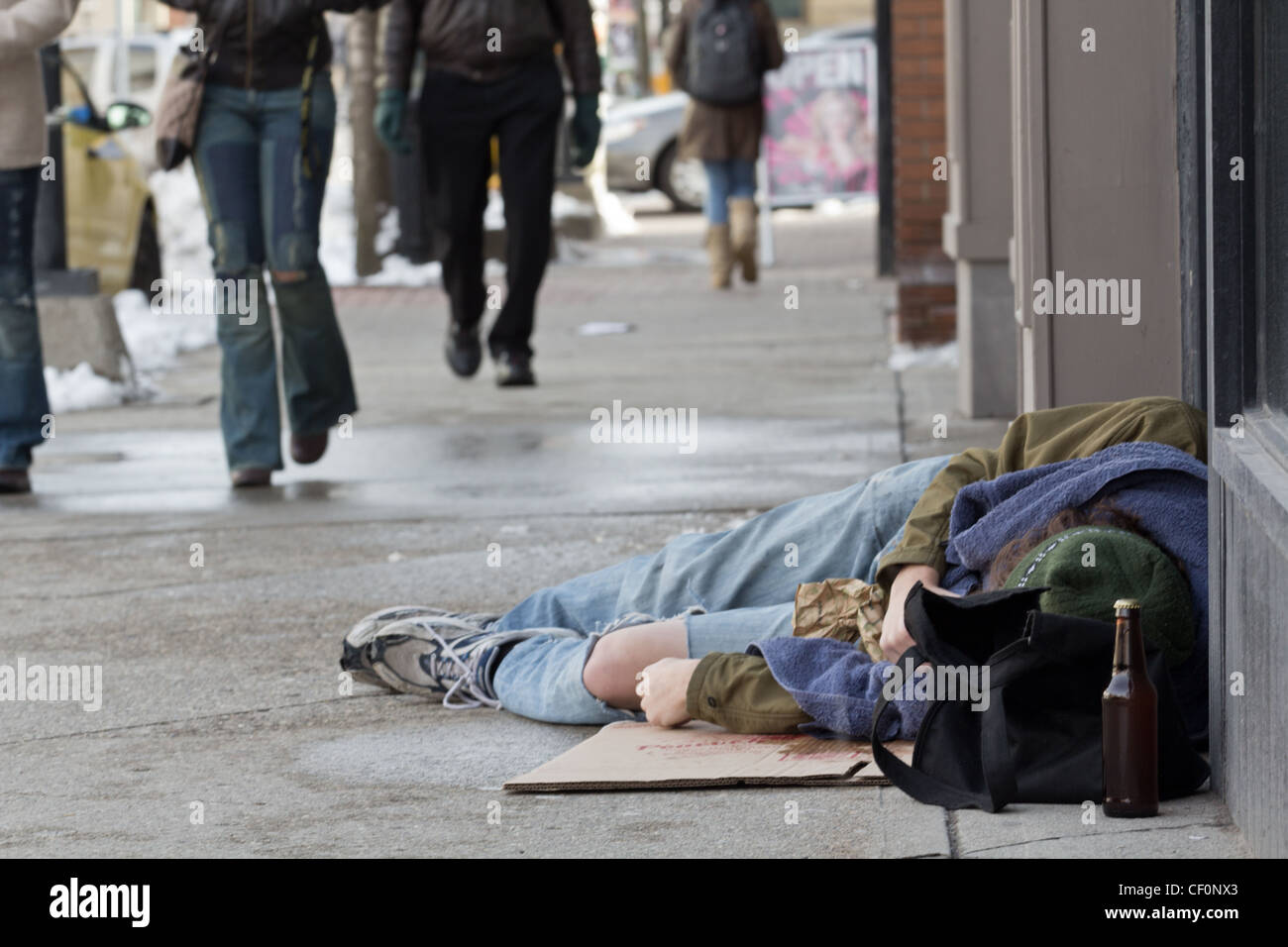 Alcoholic homeless man sleeping on street Stock Photo - Alamy