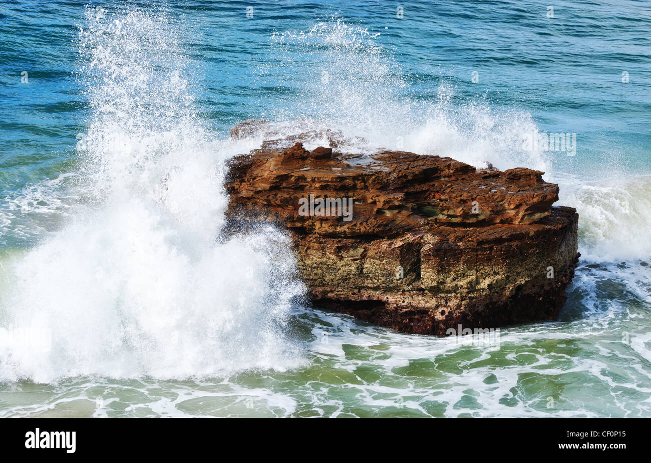 ocean waves crash on to rocks at the coast Stock Photo - Alamy
