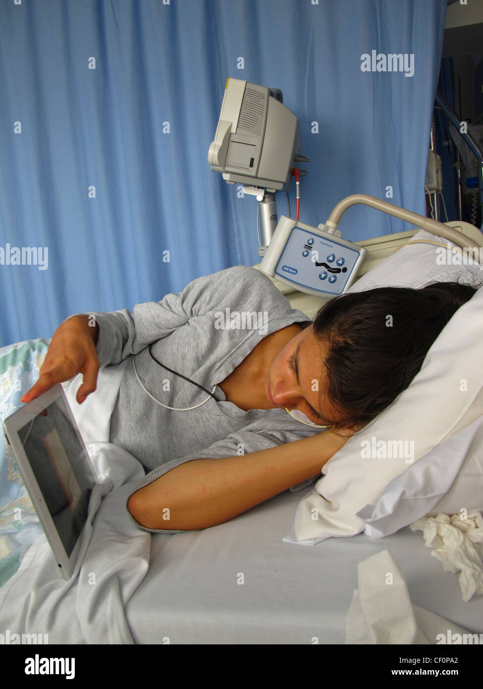 A young girl with anorexia nervosa is treated in hospital by being fed ...