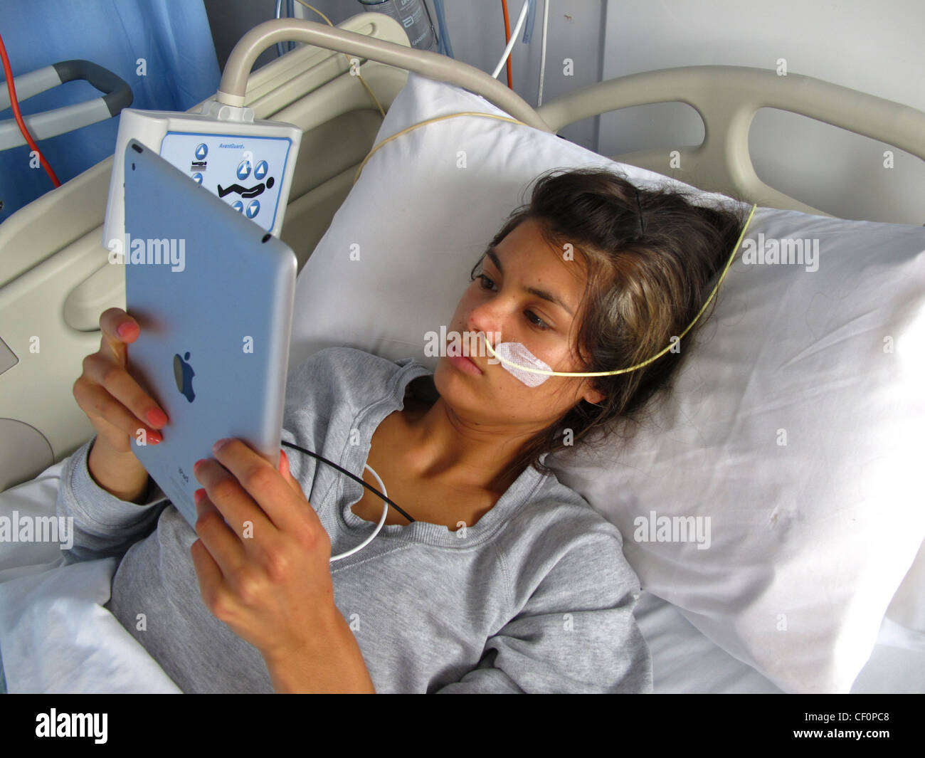 A young girl in hospital with anorexia using an iPad Stock Photo ...