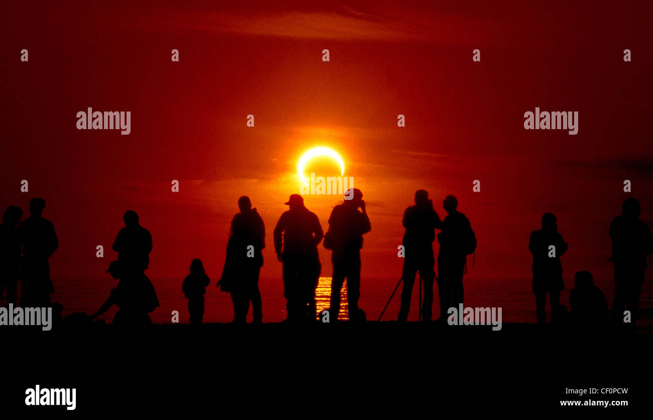 An annular solar eclipse in progress graces the sky at Dog Beach in San ...