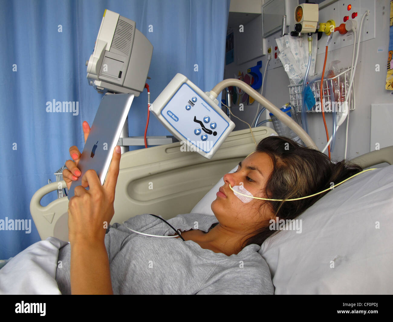 A young girl in hospital with anorexia using an iPad in the Royal ...