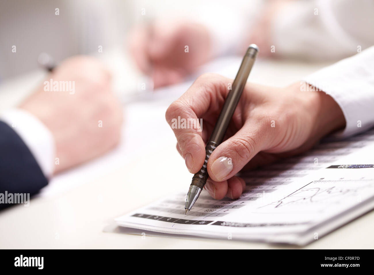 Businessman writing notes graphs planning hi-res stock photography and ...