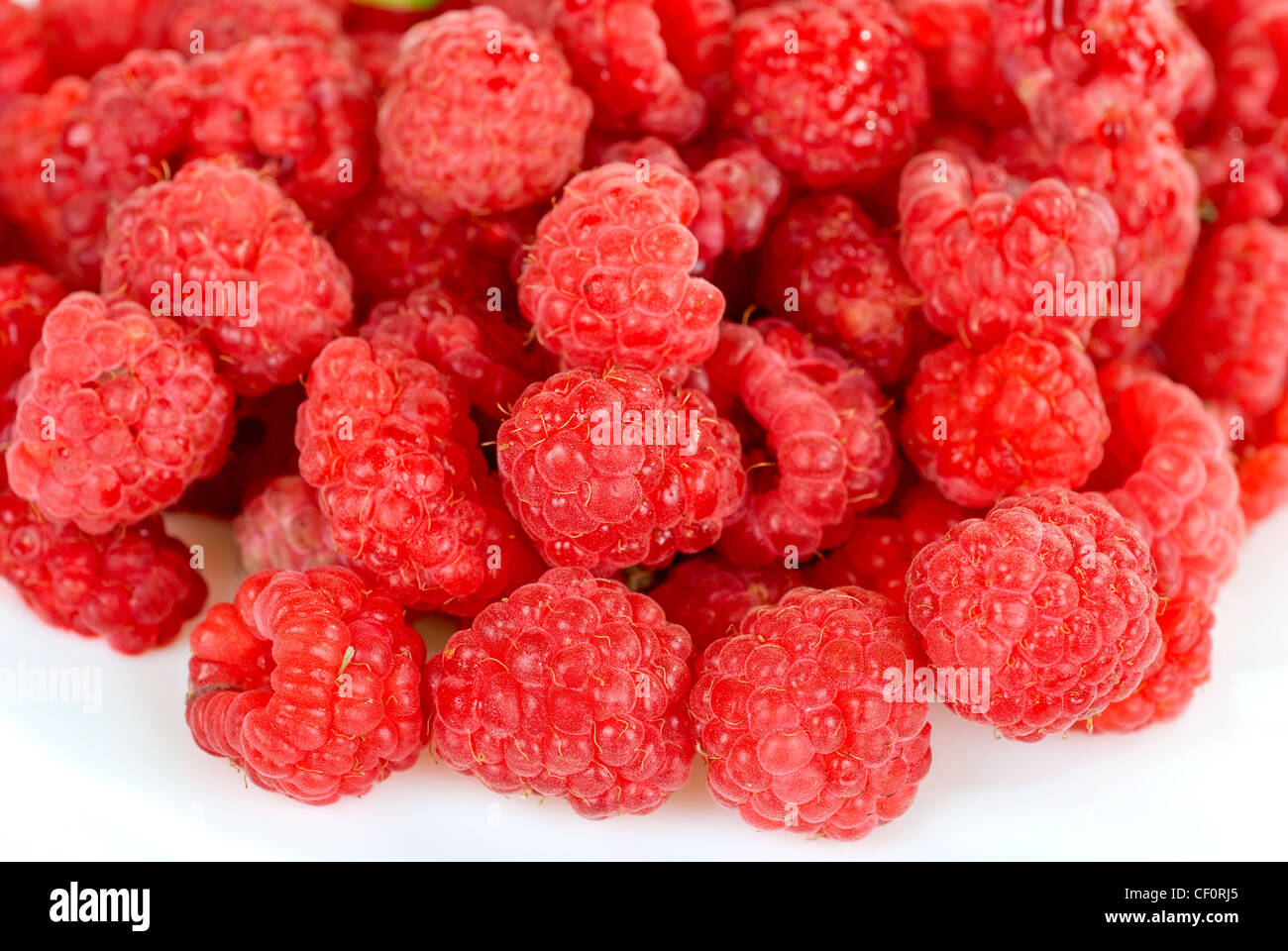 fresh raspberry closeup on a white background Stock Photo - Alamy