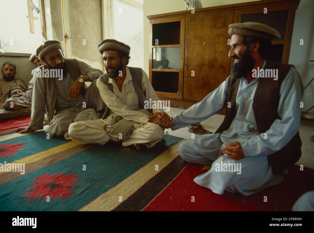 Five men in typical Afghan clothing Stock Photo - Alamy