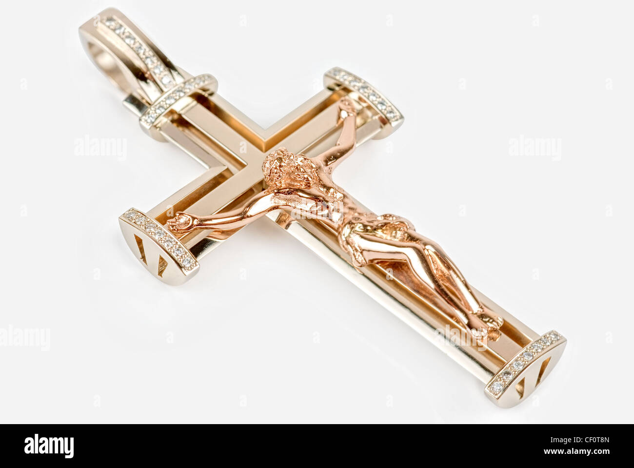 gold cross isolated on a white background Stock Photo - Alamy