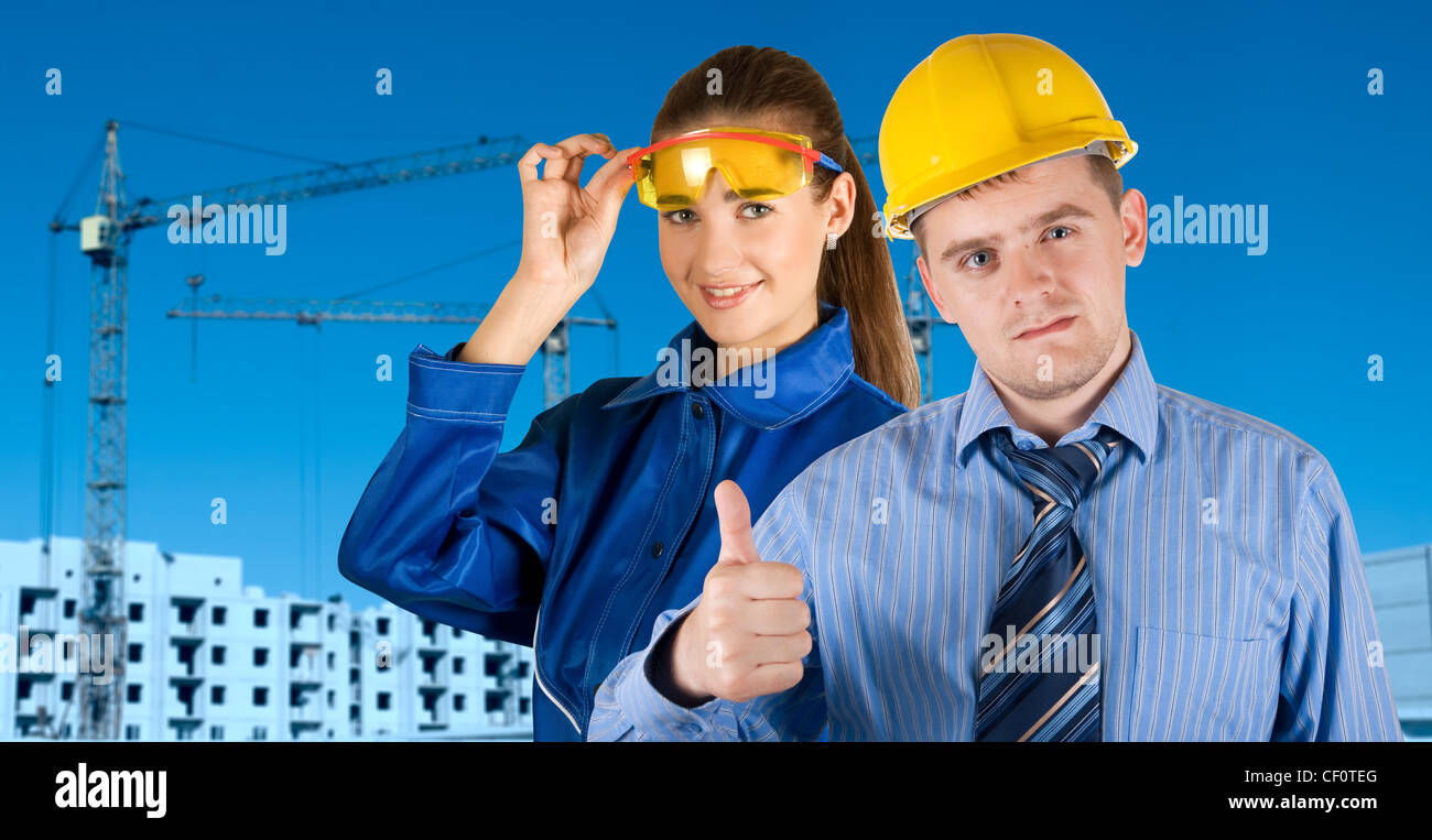Portrait of architects at in front of construction site, building and ...