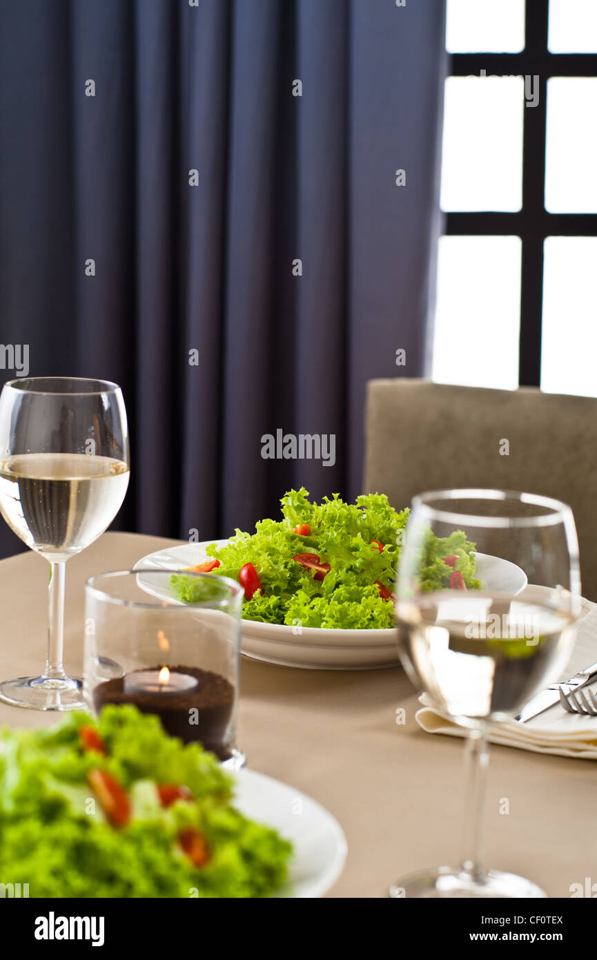 Inside interior table setting with beautiful salad Stock Photo - Alamy