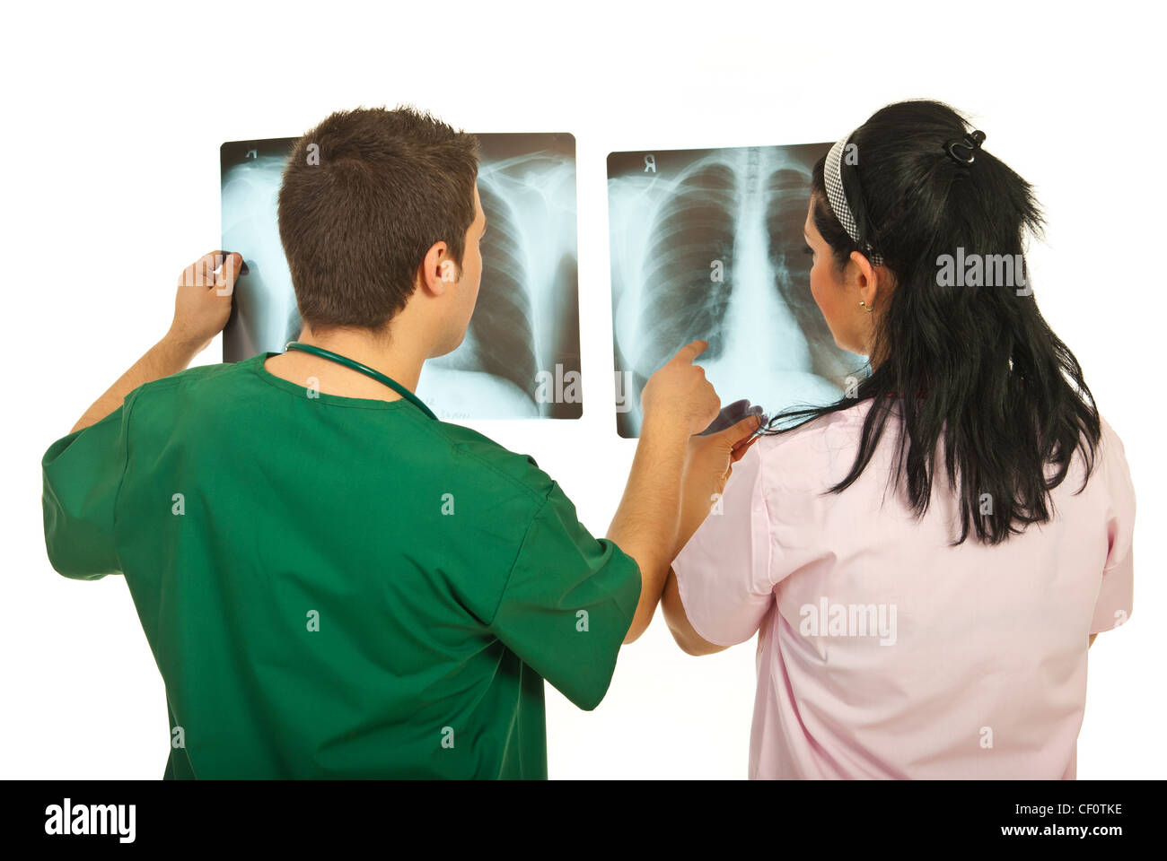 Back of two doctors checking X-rays isolated on white background Stock ...