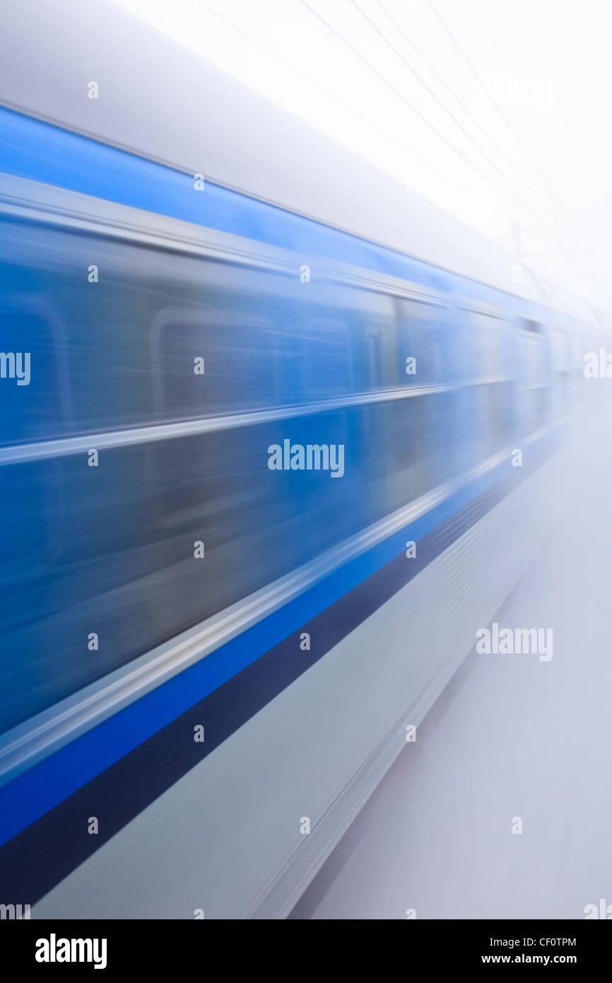 Train going fast in a snow storm Stock Photo - Alamy