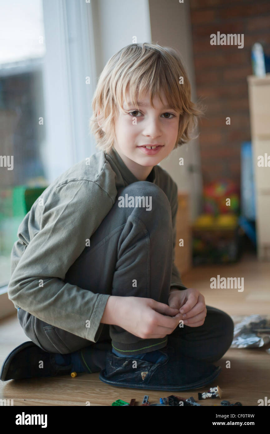 Boy playing indoor Stock Photo - Alamy