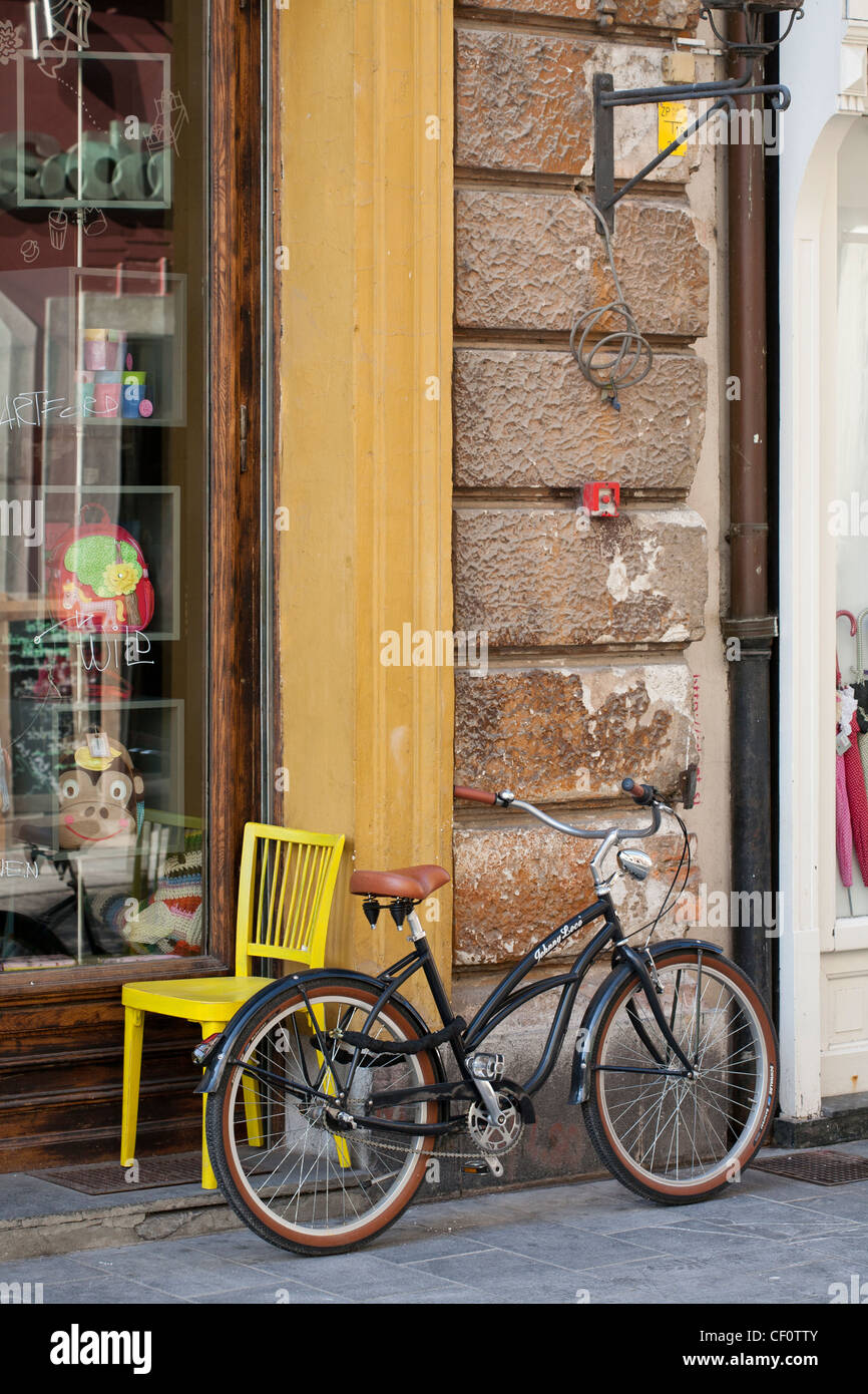 Bike leaning against the wall Stock Photo - Alamy
