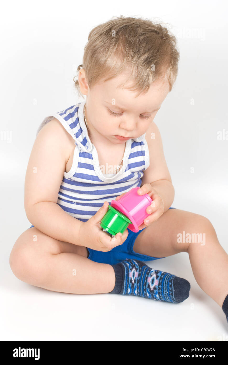 Small baby with a toy Stock Photo - Alamy